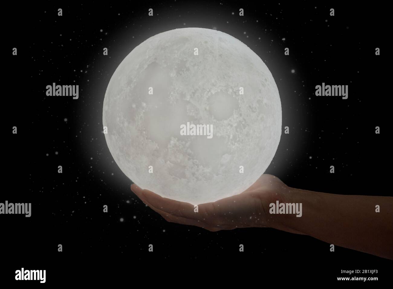 Human hand holding moon hi-res stock photography and images - Alamy