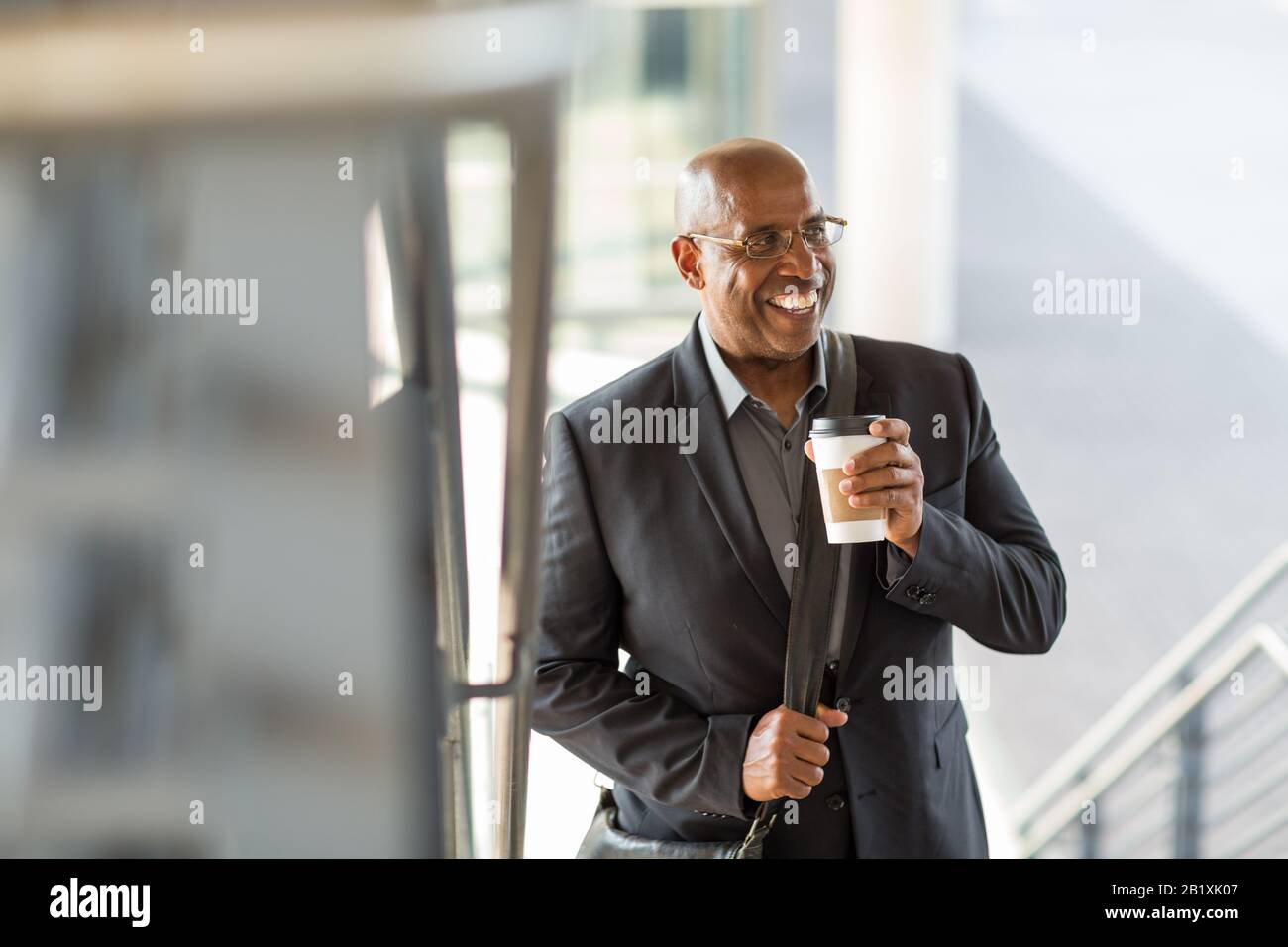 African American businessman drinking coffee on his way to work Stock ...