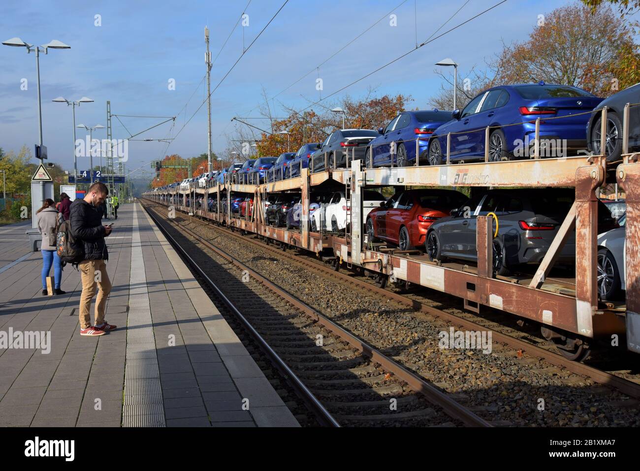 Passengers waiting for a Deutsche Bahn train at Buxtehude station ...