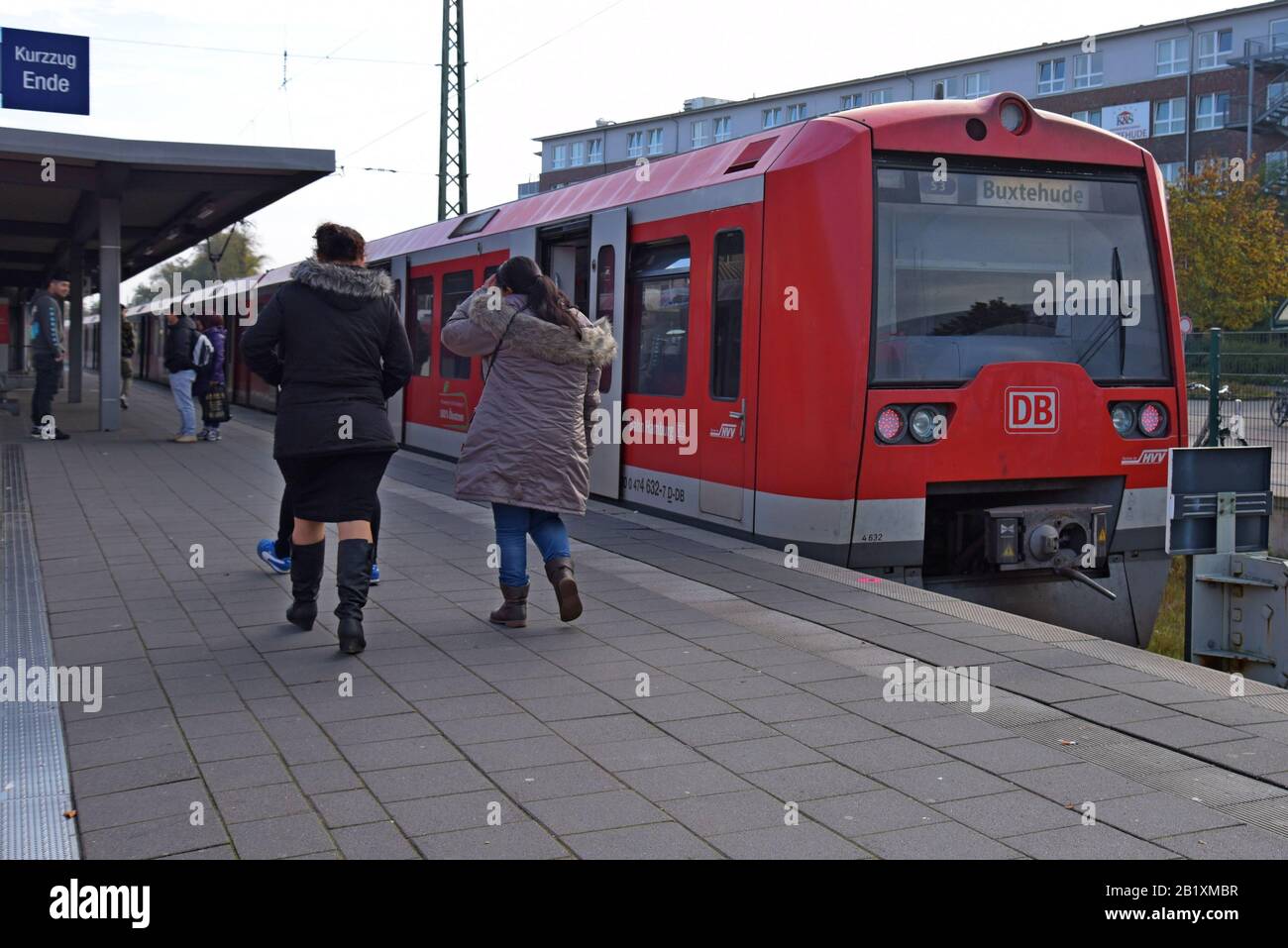 Passengers on platform catching a Deutsche Bahn train at Buxtehude ...