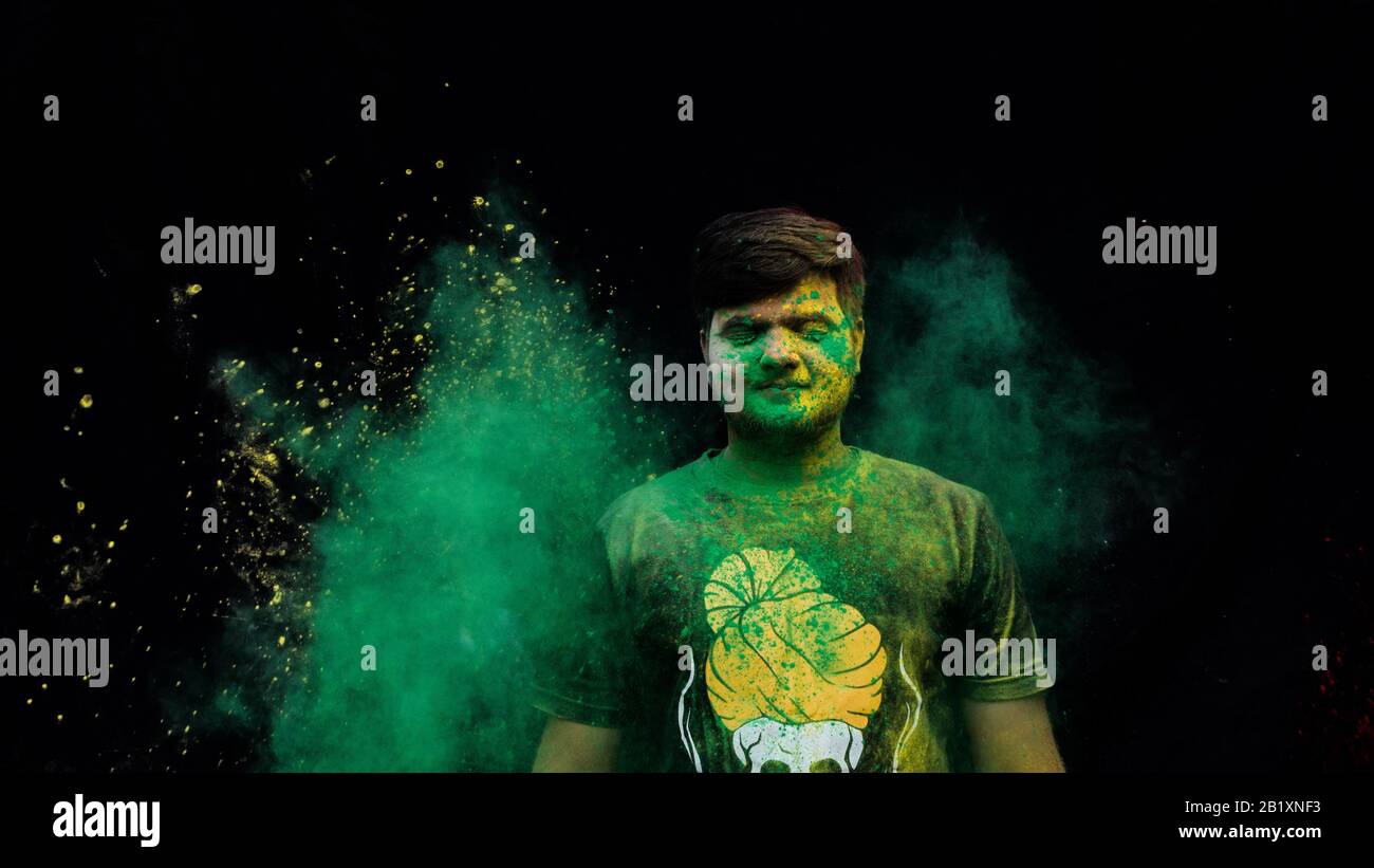 Young man with holi colors. holi is a festival of India. It is festival ...