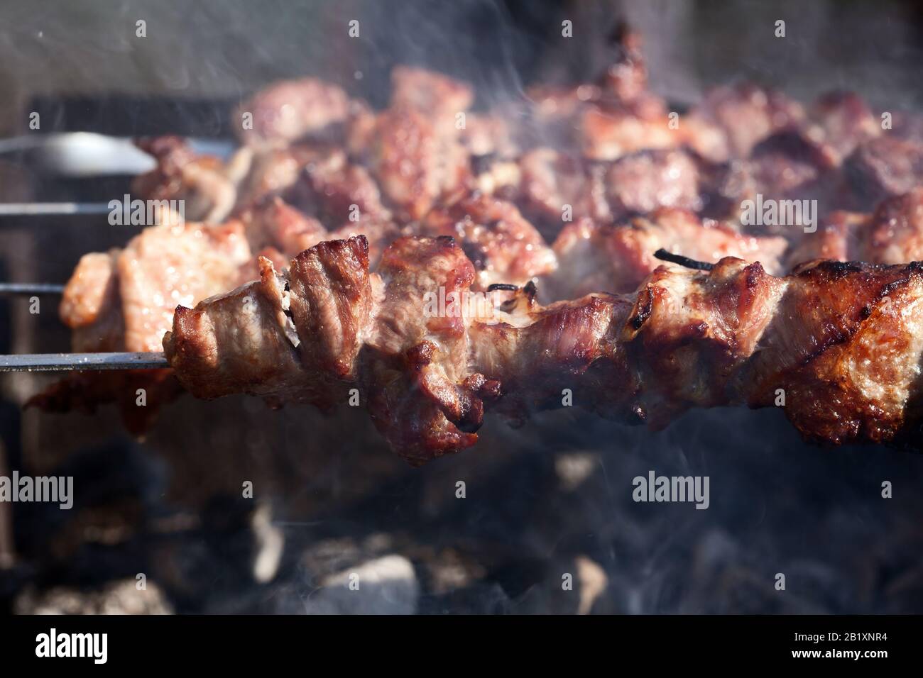 Meat baked on coals smoke hi-res stock photography and images - Alamy