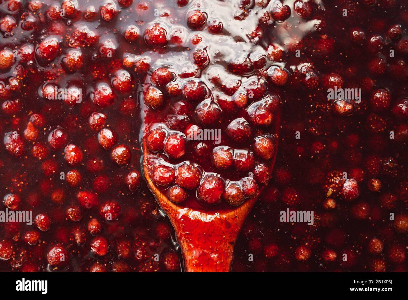 beautiful glare texture of strawberry jam closeup, food background ...