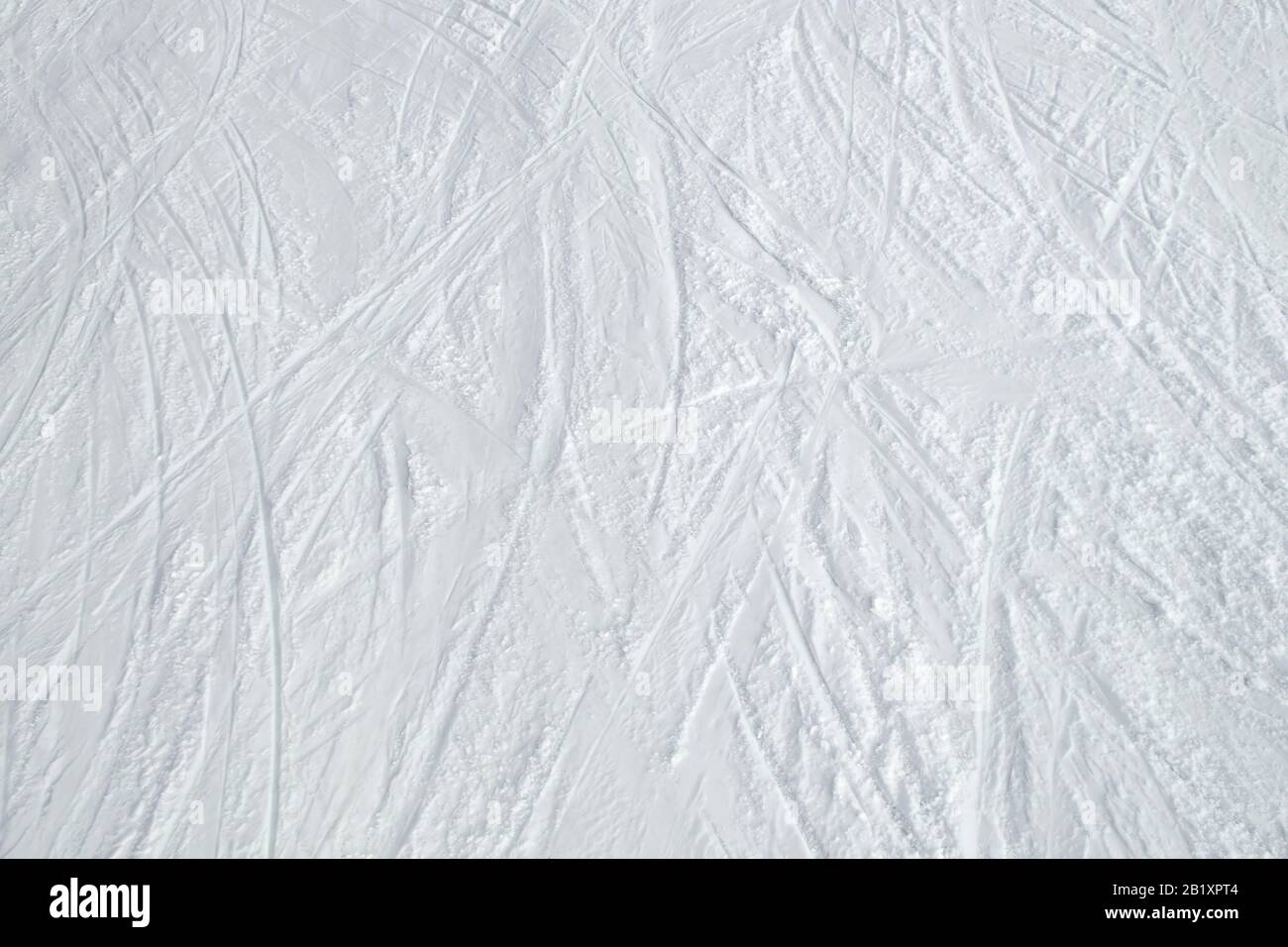 Top view of ski tracks on snow background Stock Photo - Alamy