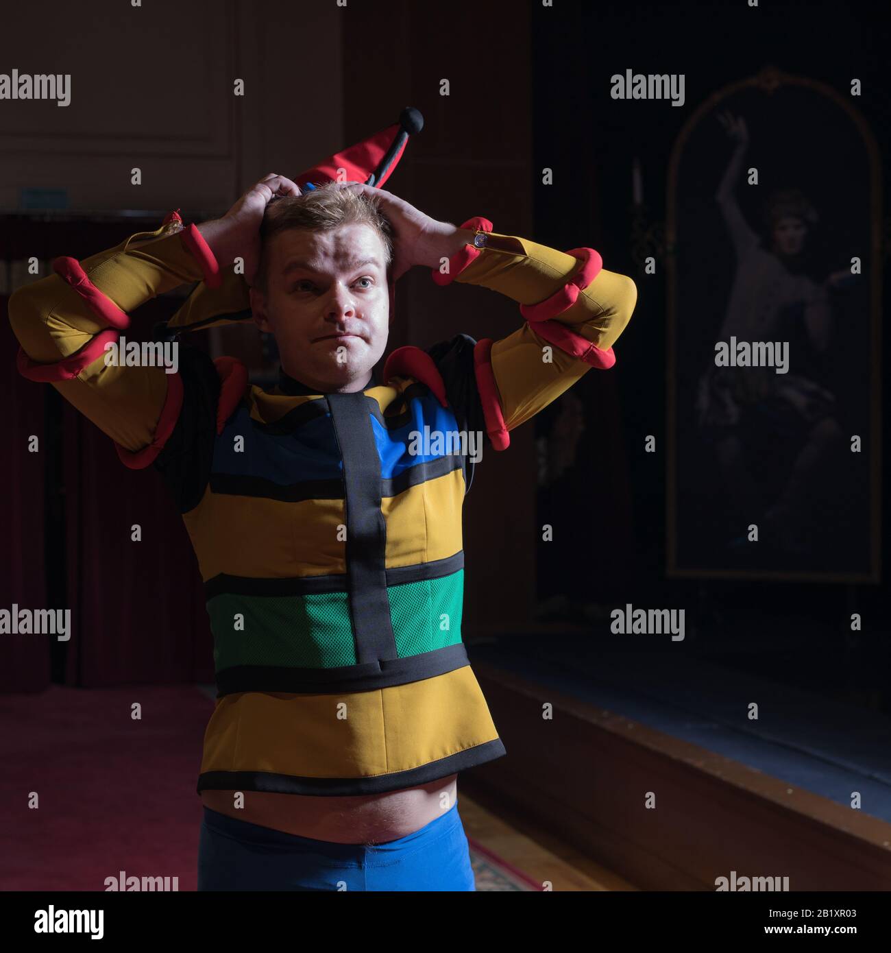 Actor dressed jester's costume in interior of old theater Stock Photo ...