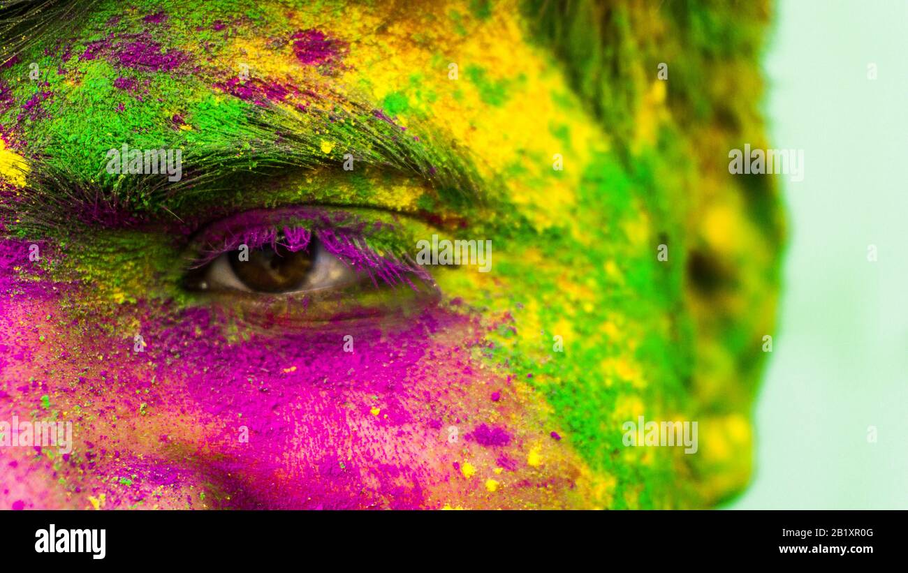 Eye with holi colors. holi is a festival of India. It is festival of ...