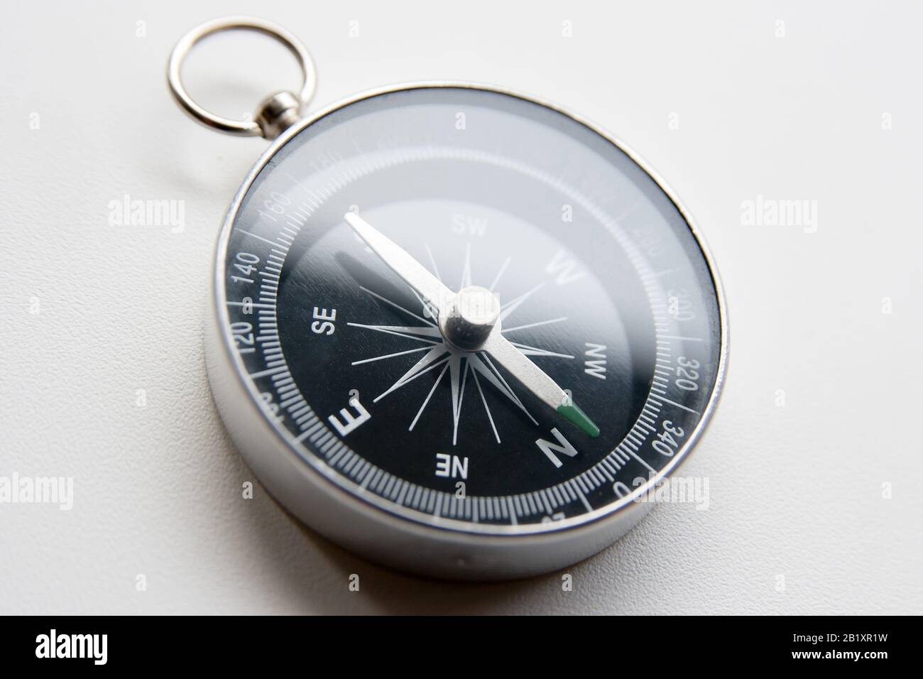 black compass on a white background in perspective with flare Stock ...