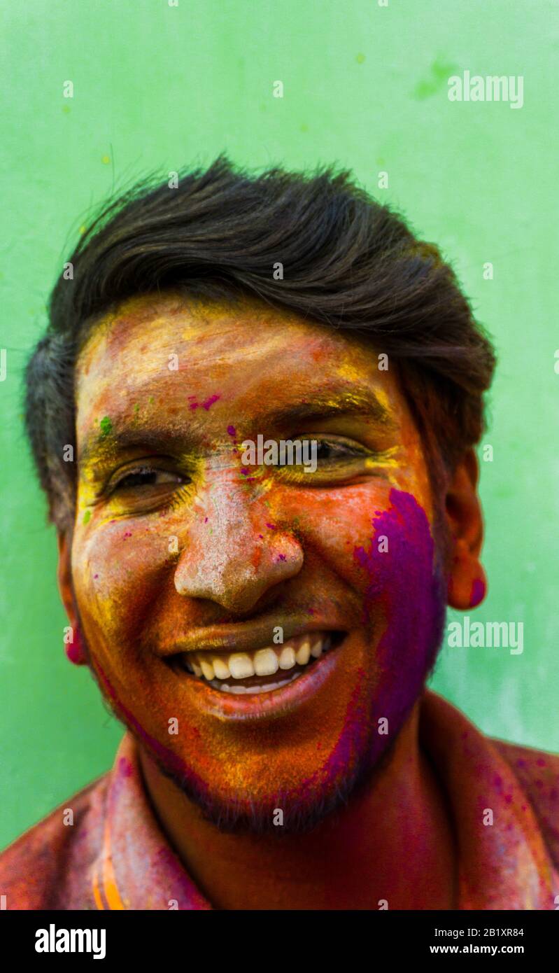 Young man celebrating holi with colors. holi is a festival of India. It ...