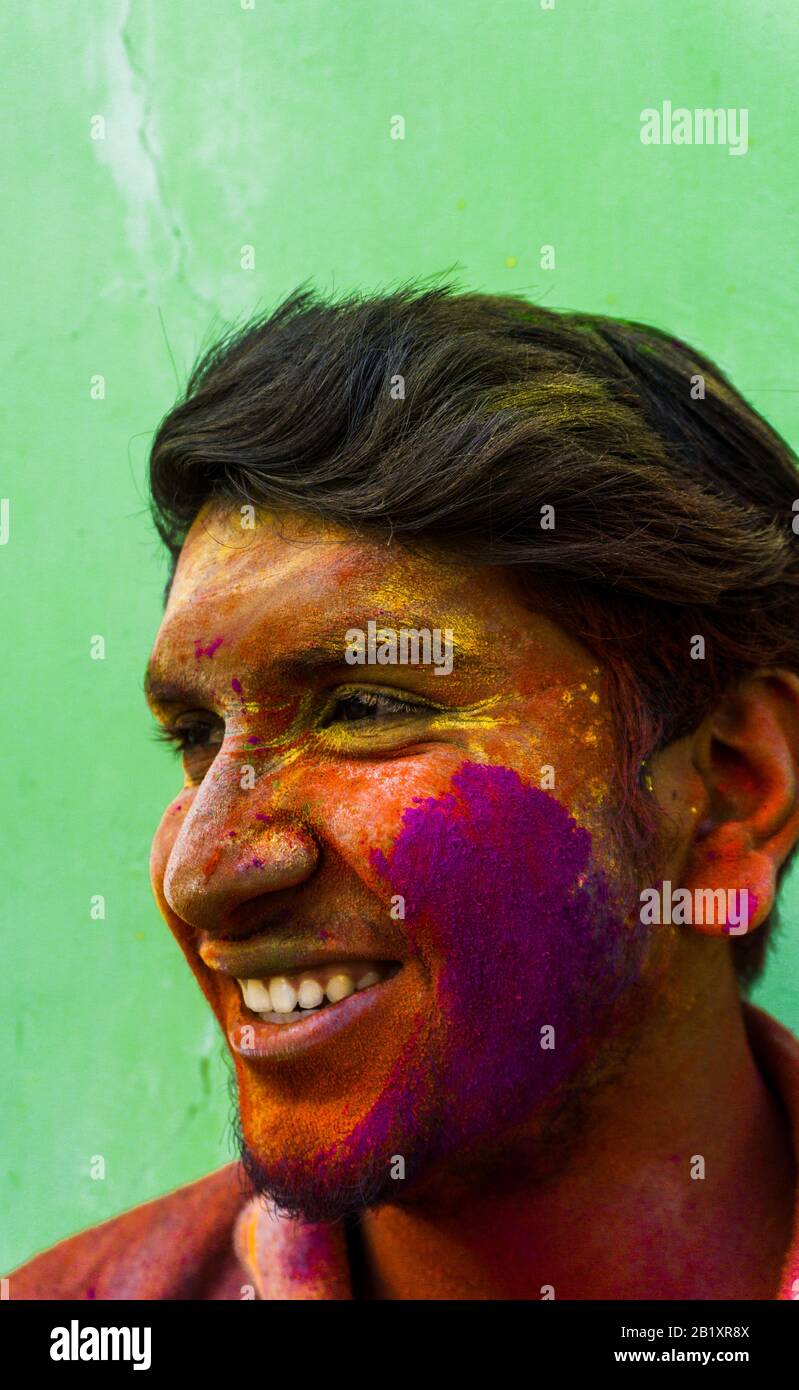 Young man celebrating holi with colors. holi is a festival of India. It ...