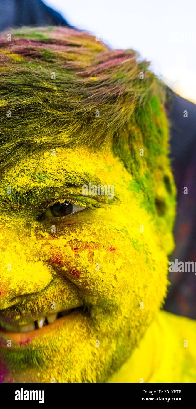 Young man celebrating holi with colors. holi is a festival of India. It ...