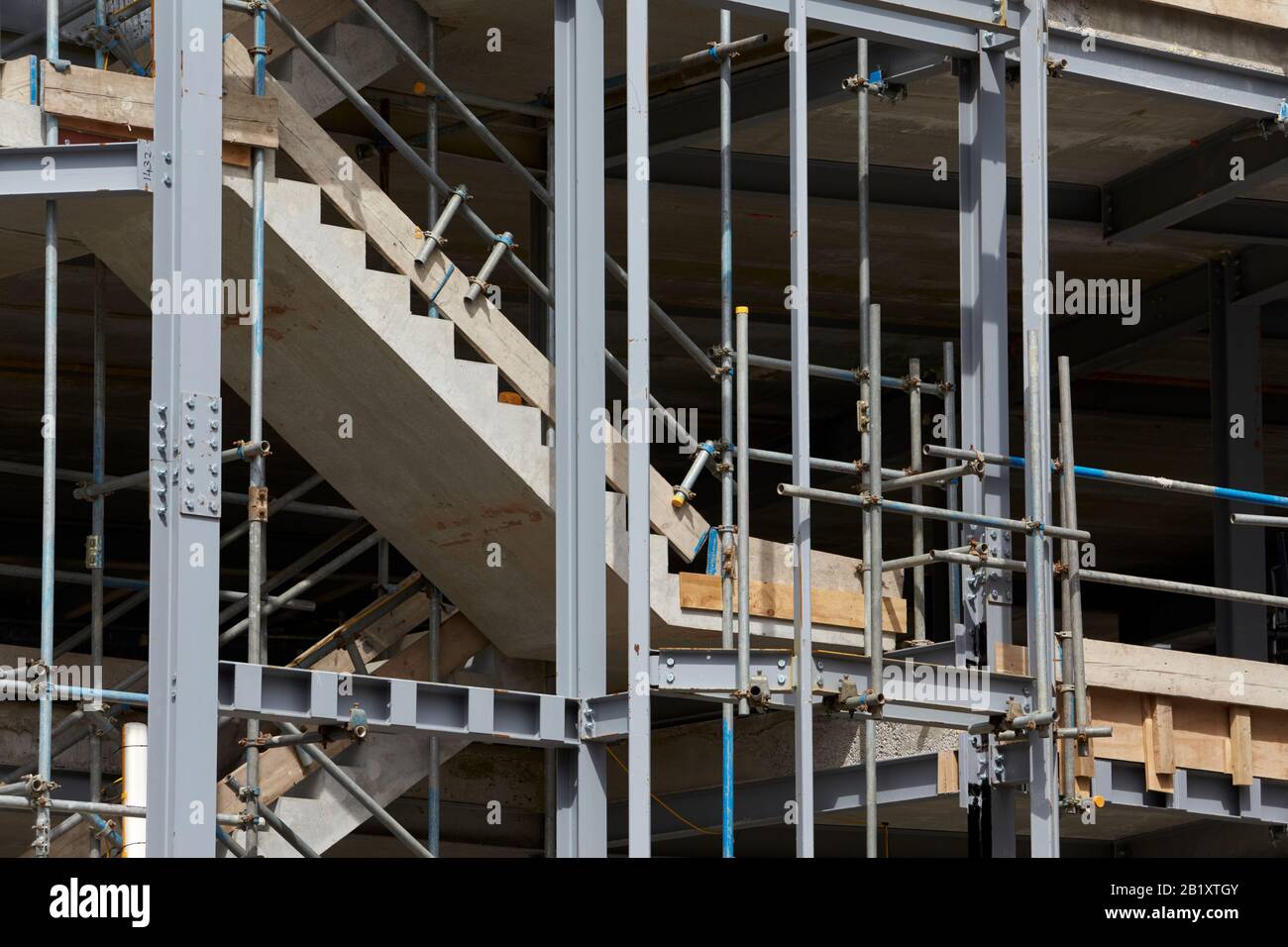 Steelwork and scaffolding, steel frame and concrete stairs of ...
