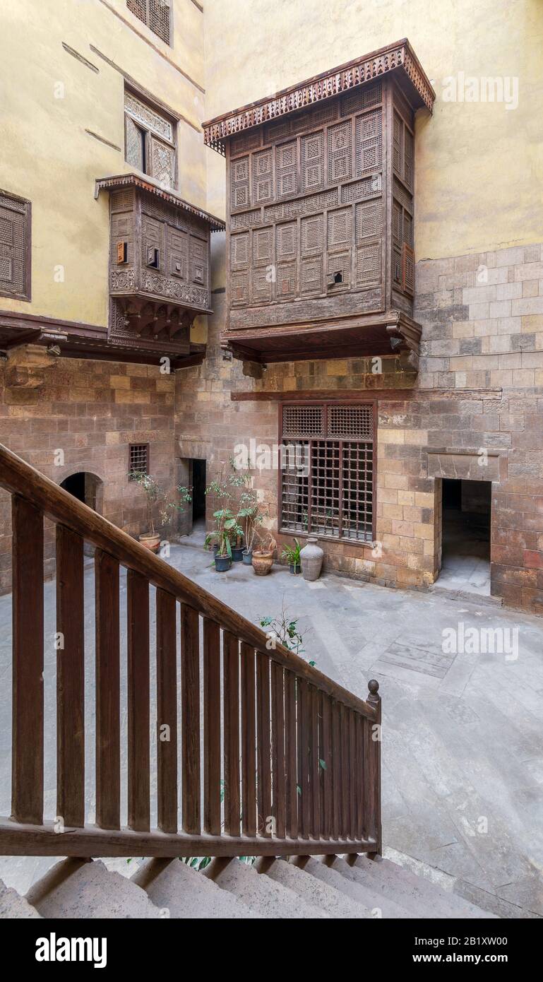 Staircase with wooden balustrade revealing facade of ottoman era ...