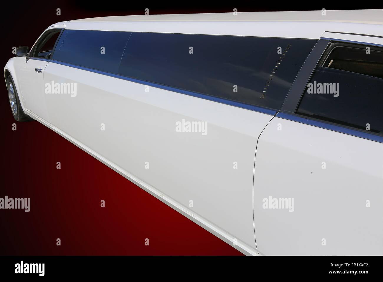 big white limousine on red black gradient background Stock Photo - Alamy
