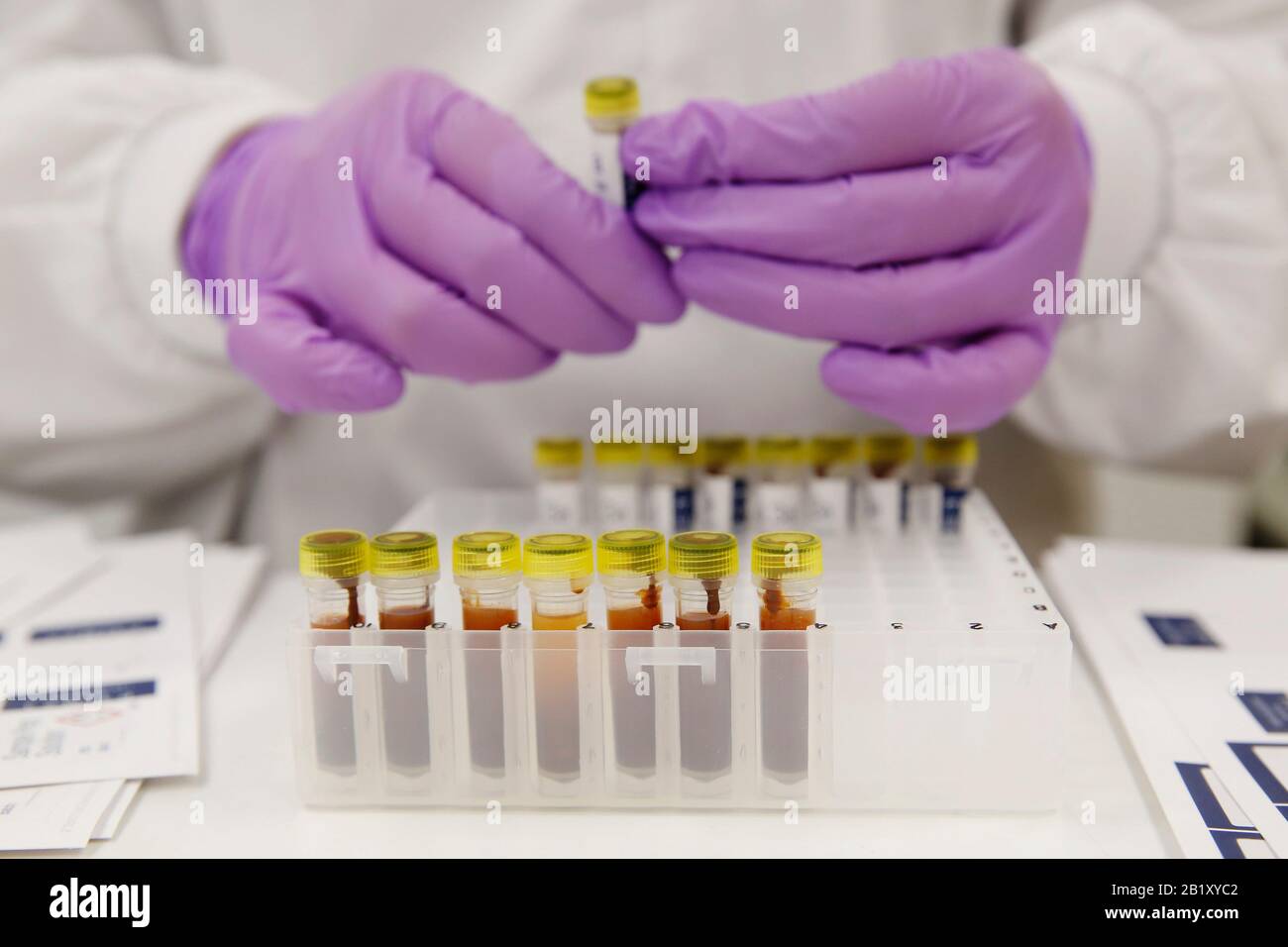 Trainee production supervisor assembles and labels components of an ...