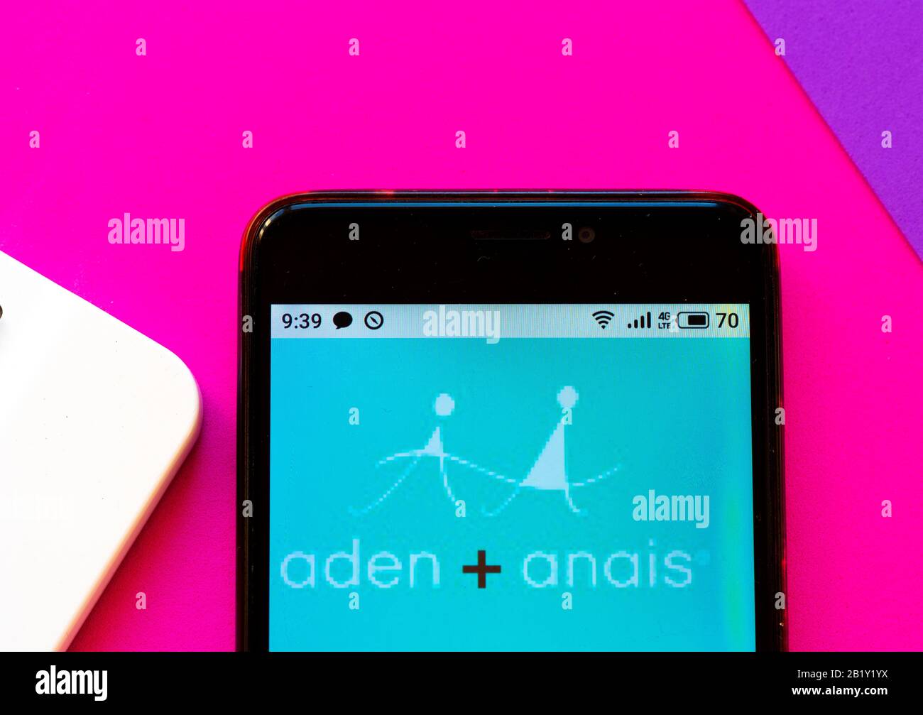 In this photo illustration an Aden & Anais logo seen displayed on a ...