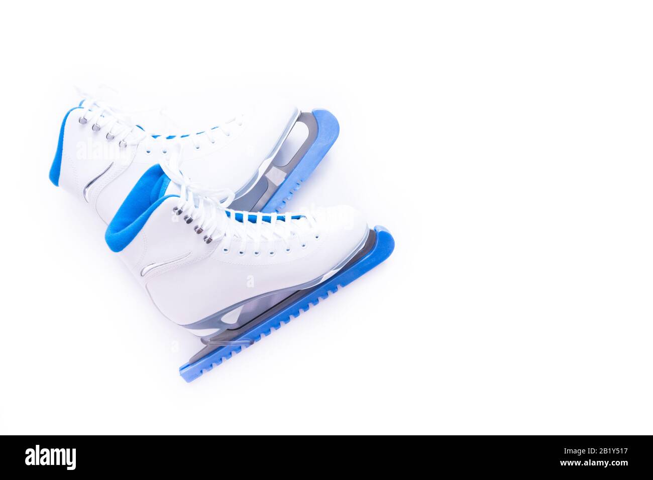 Flat lay. New white figure skates on a white background Stock Photo - Alamy