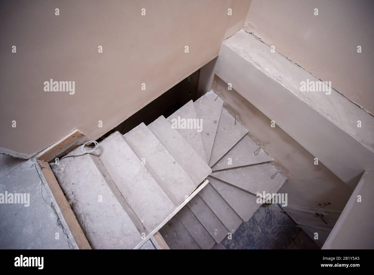 Concrete structure staircase. New house construction interior with ...