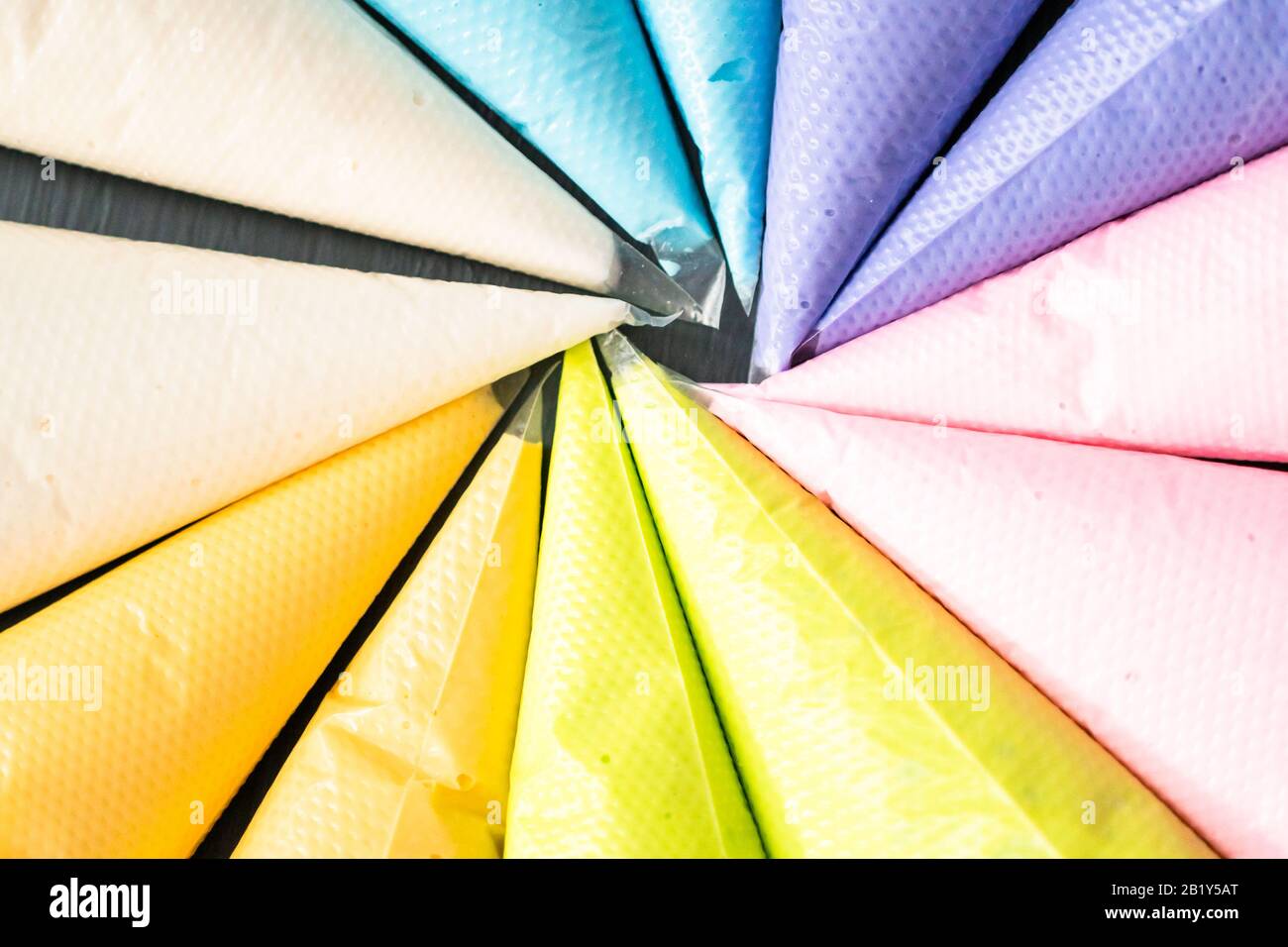Variety of colors of royal icing in plastic piping bags Stock Photo - Alamy