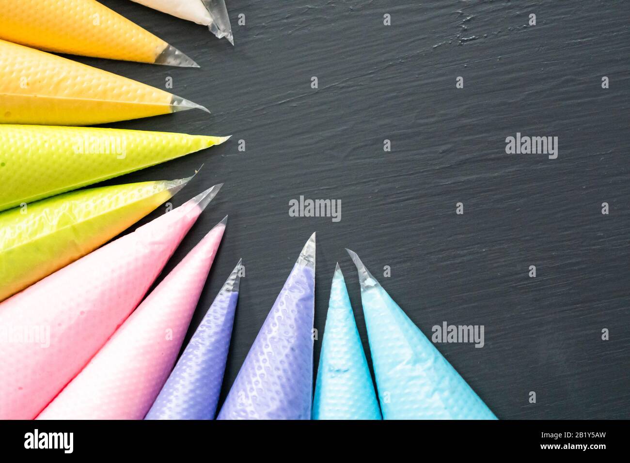 Variety of colors of royal icing in plastic piping bags Stock Photo - Alamy