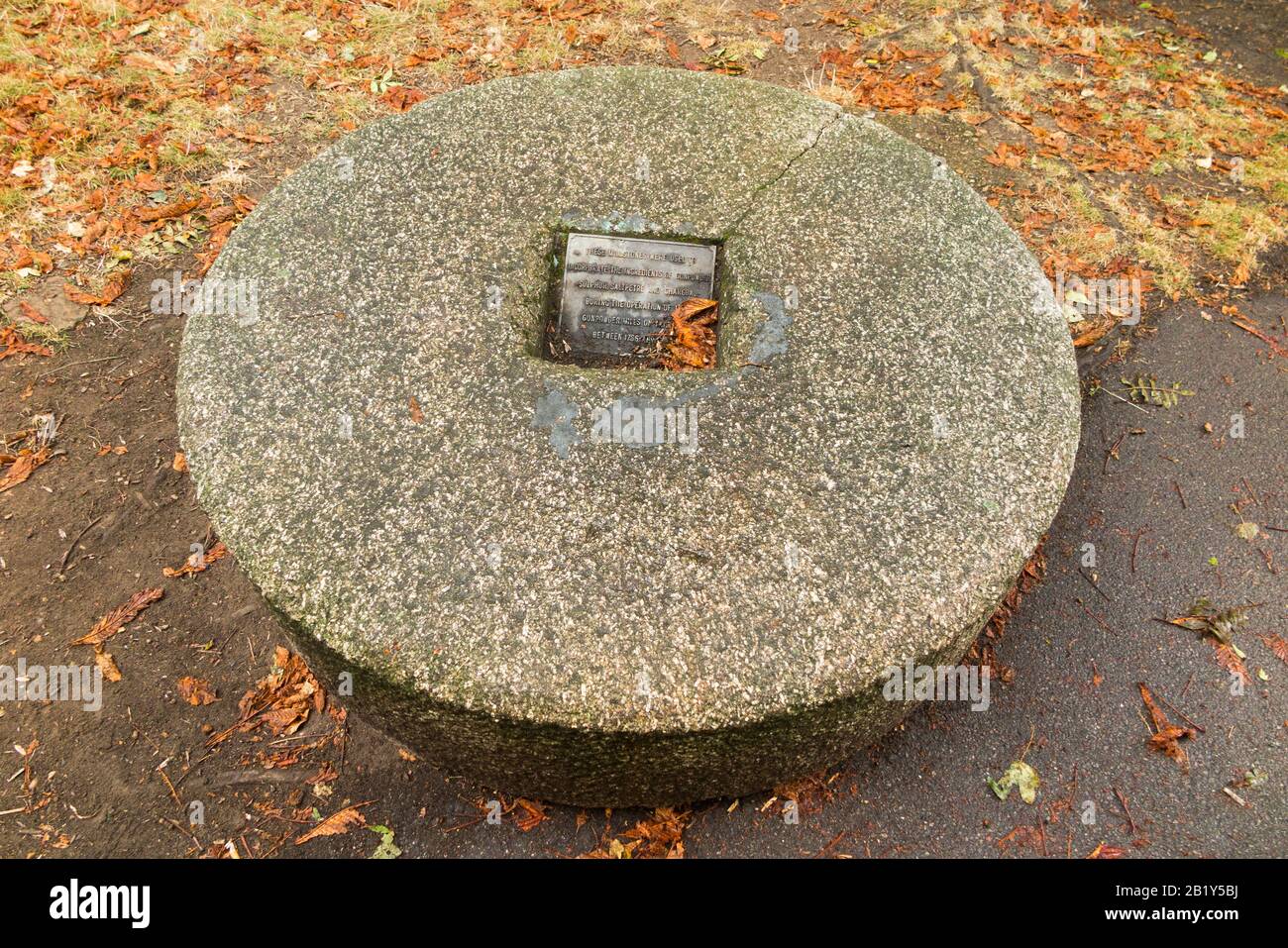 Millstone / Mill stone with small explanatory plaque at the Shot Tower ...