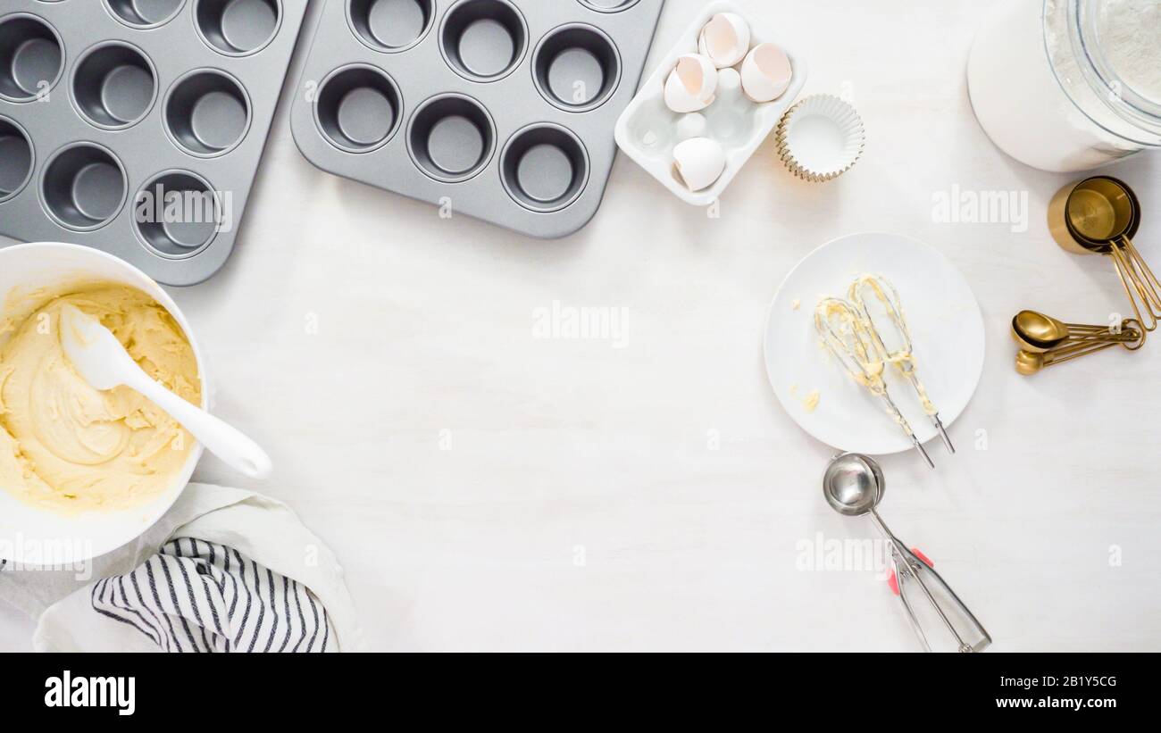 Flat lay. Step by step. Mixing batter to bake vanilla cupcakes with ...