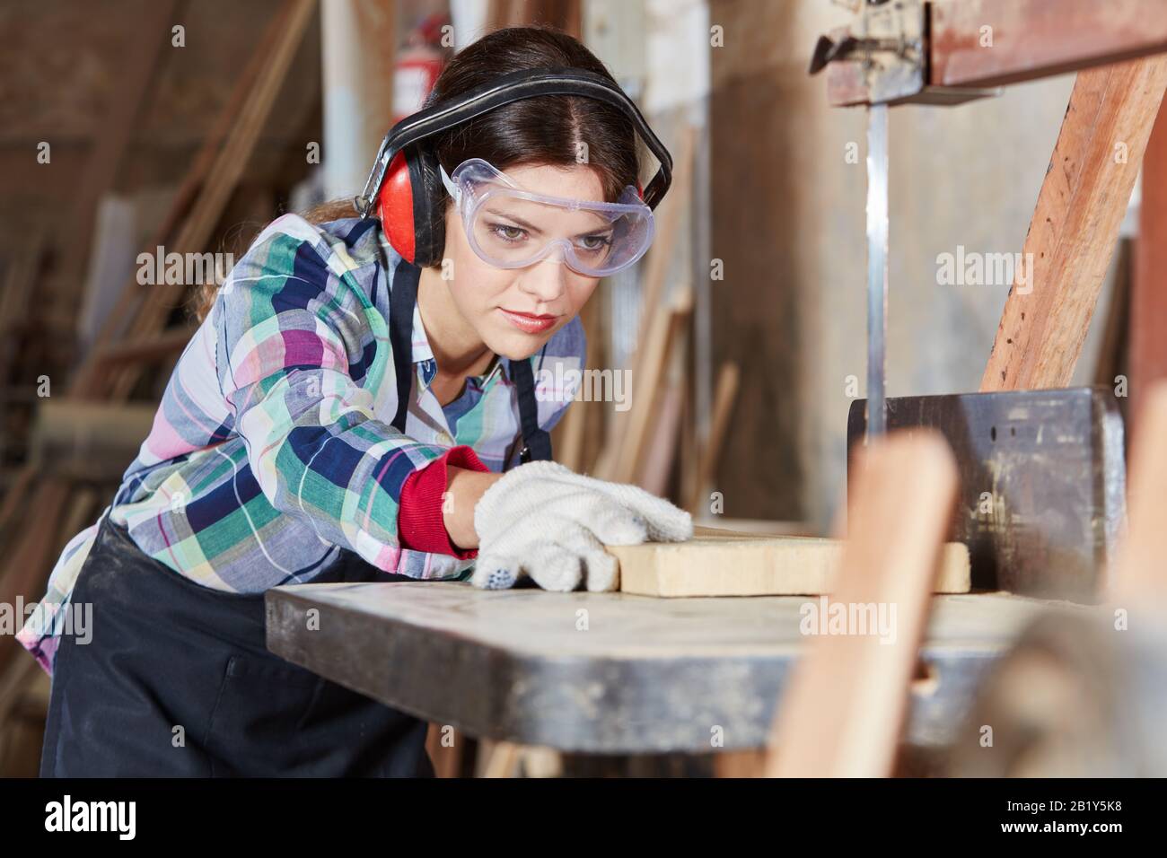 Woman sawing wood hi-res stock photography and images - Alamy