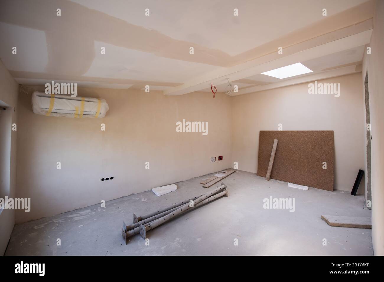 interior of construction site with drywall completely installed at new ...