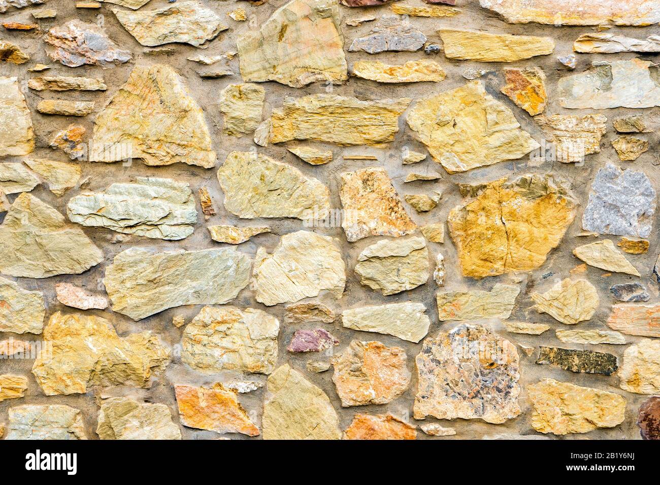 Wall pattern texture background. Surface with asymmetrical stones. Old ...