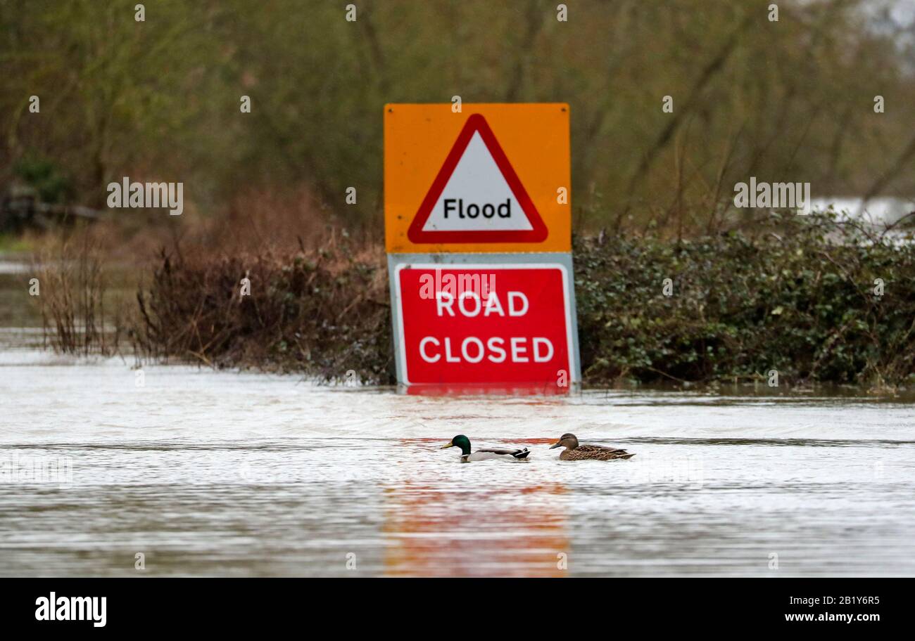 The B4213 near Lower Apperley is submerged under flood water after the ...