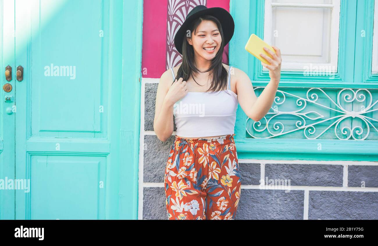 Asian social influencer woman making story for social network with ...