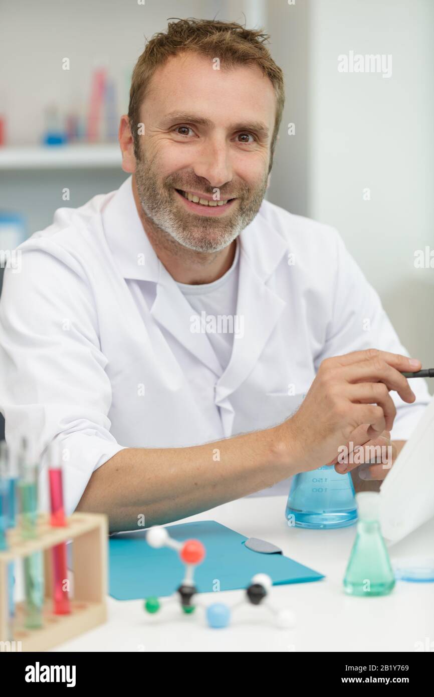 smiling lab technician giving thumbs up Stock Photo - Alamy