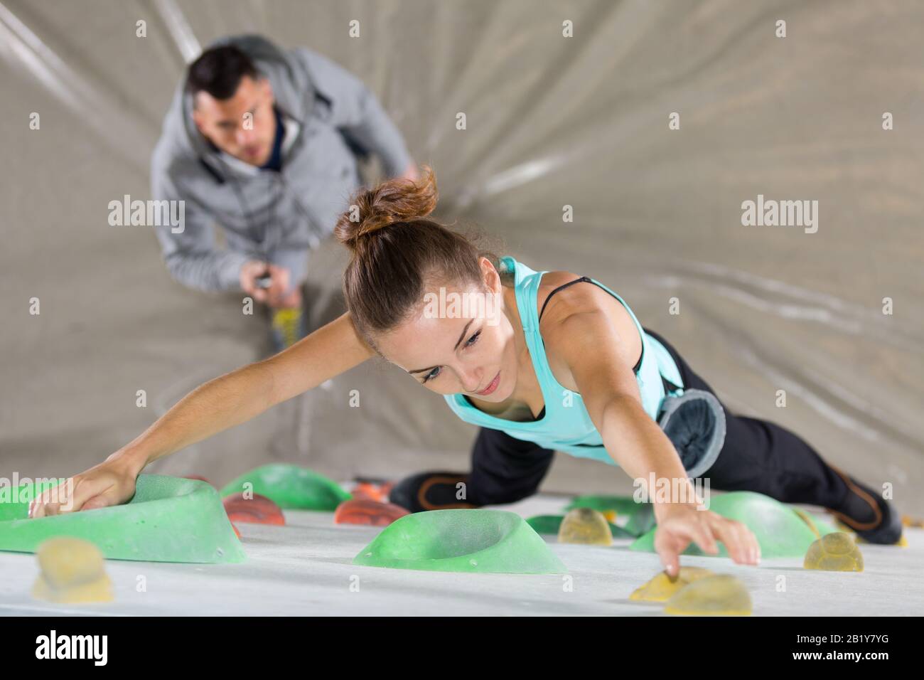 Female rock climber gripping hi-res stock photography and images - Alamy
