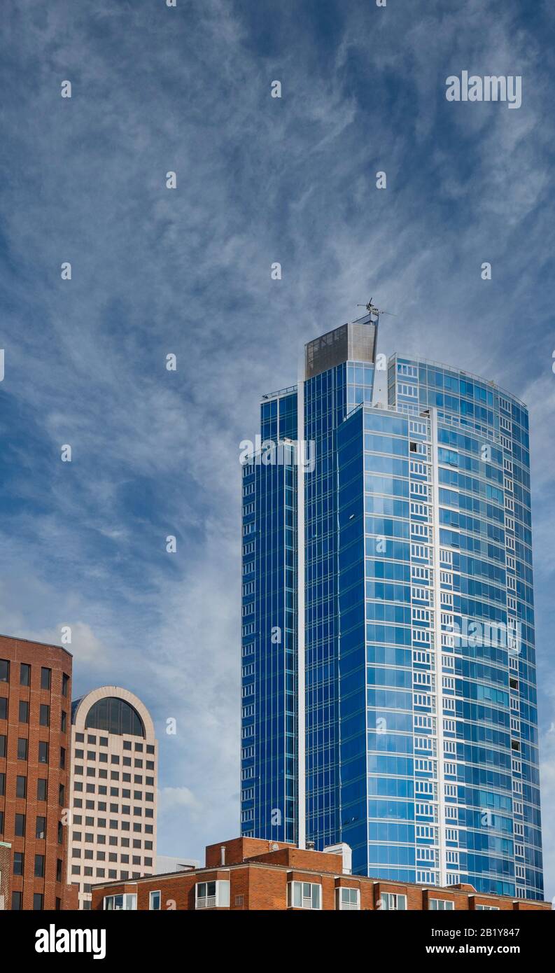 Blue Glass Tower Rising Into Sky Stock Photo - Alamy