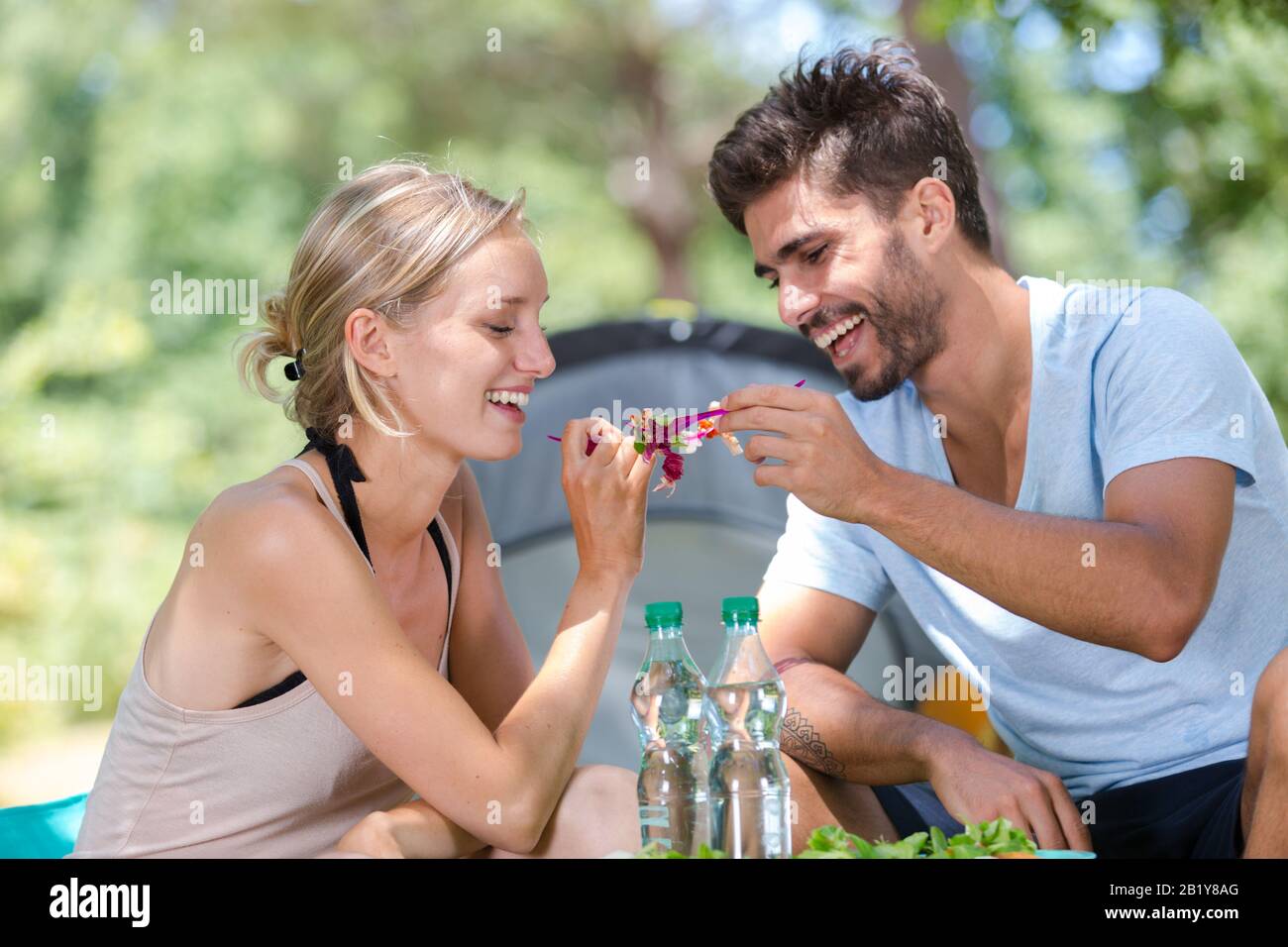 couple eating dinner on camping Stock Photo - Alamy