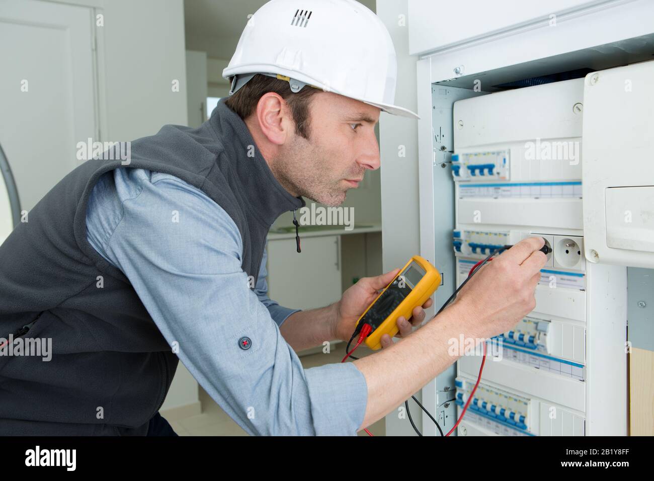 engineer checking the electrical cabinet at control room Stock Photo ...