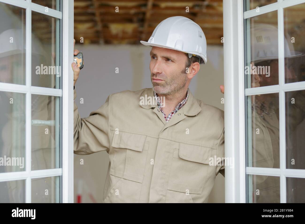 the window fitting installation process Stock Photo - Alamy