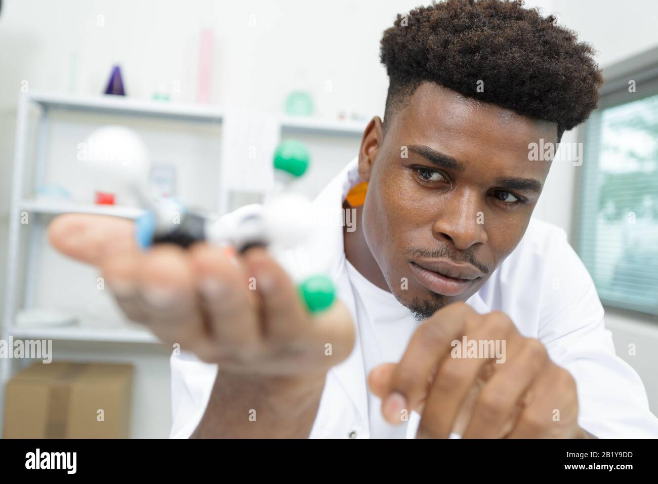 scientist working attentively with dna model in laboratory Stock Photo ...