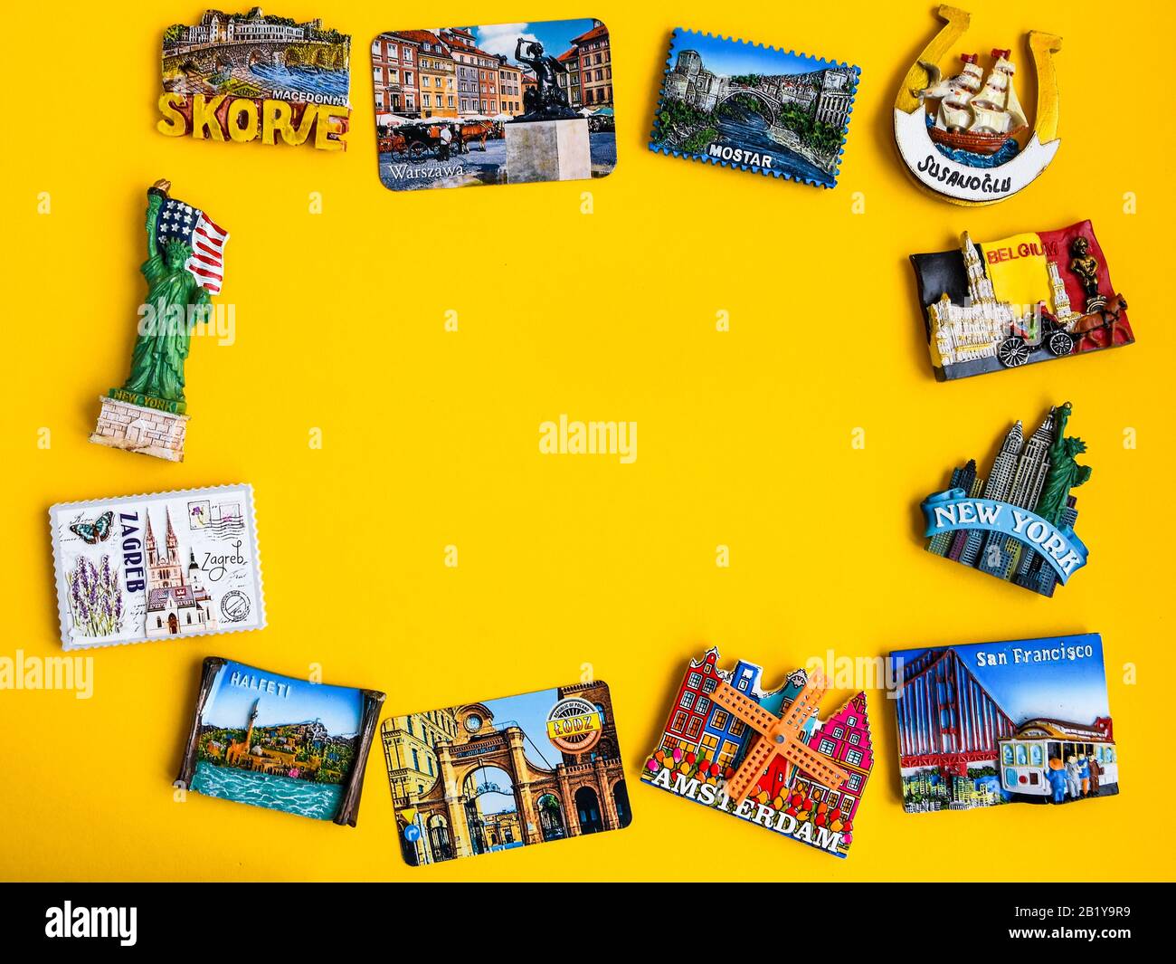 Magnets from different countries on yellow background, travel concept ...