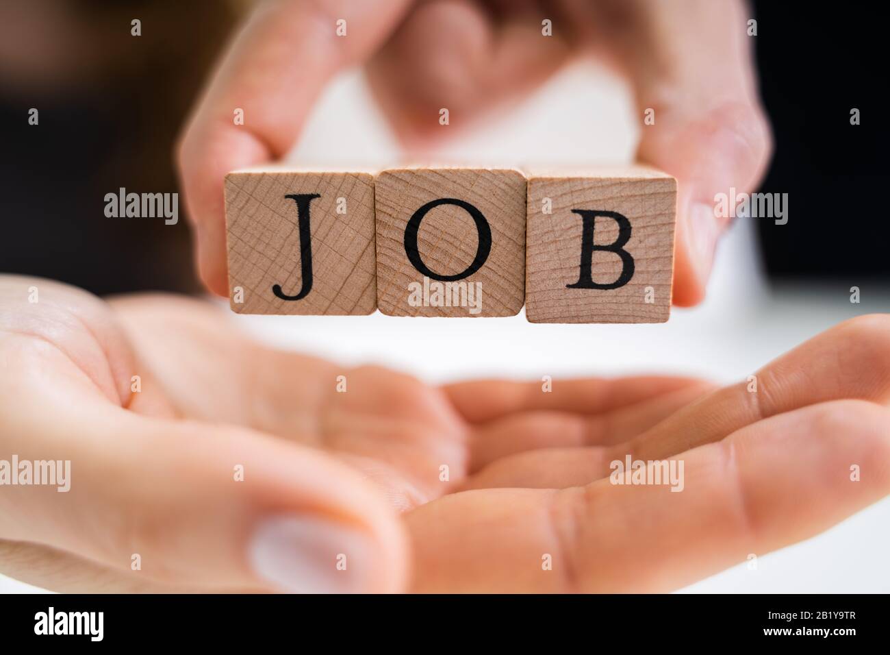 Businessperson Giving Wooden Block With Job Text To Candidate Stock ...