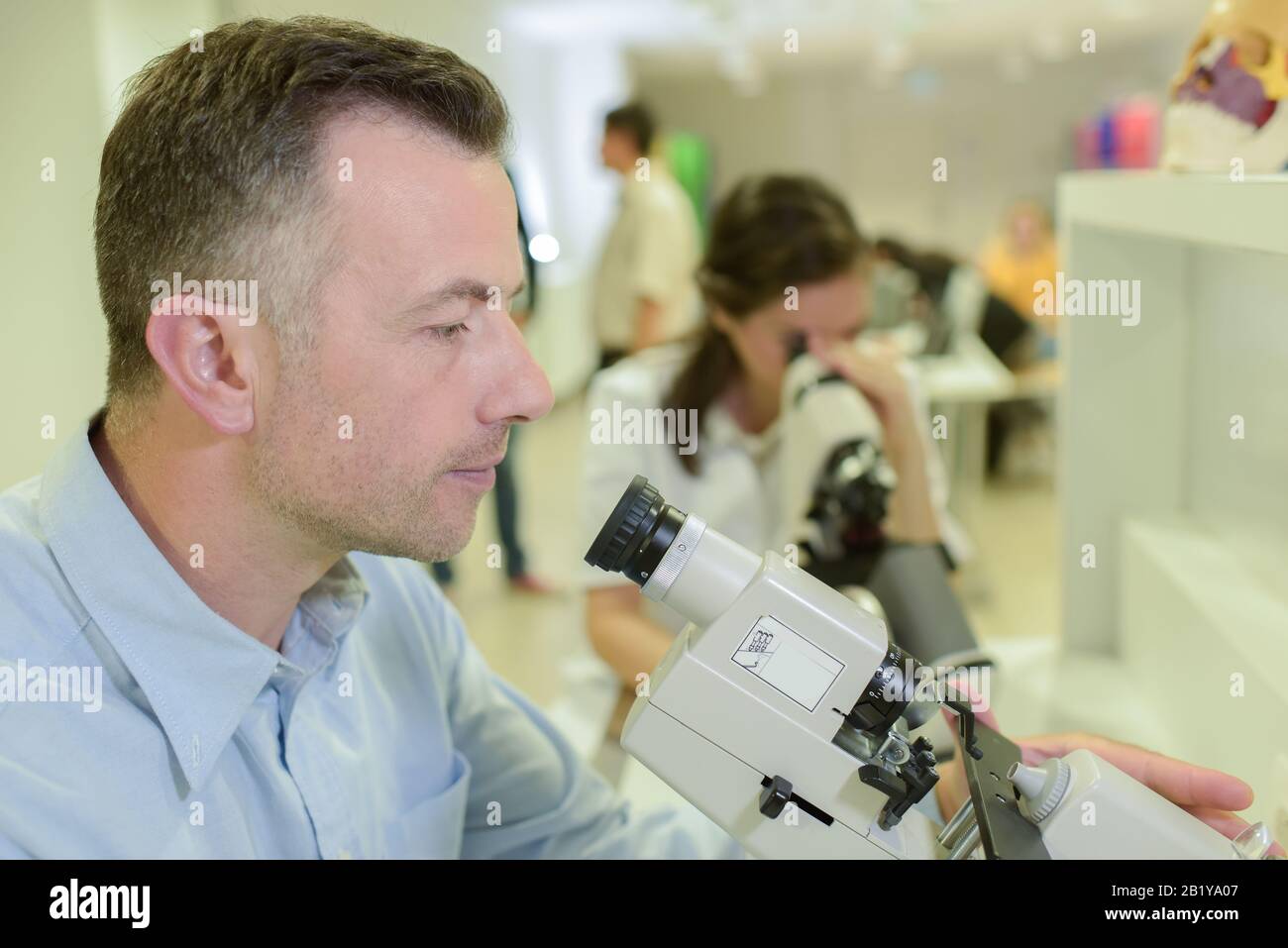 a doctor man with microscope Stock Photo - Alamy