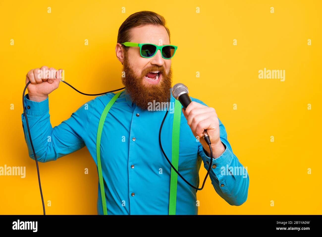 Portrait of positive energetic popular singer perform new hit sing ...