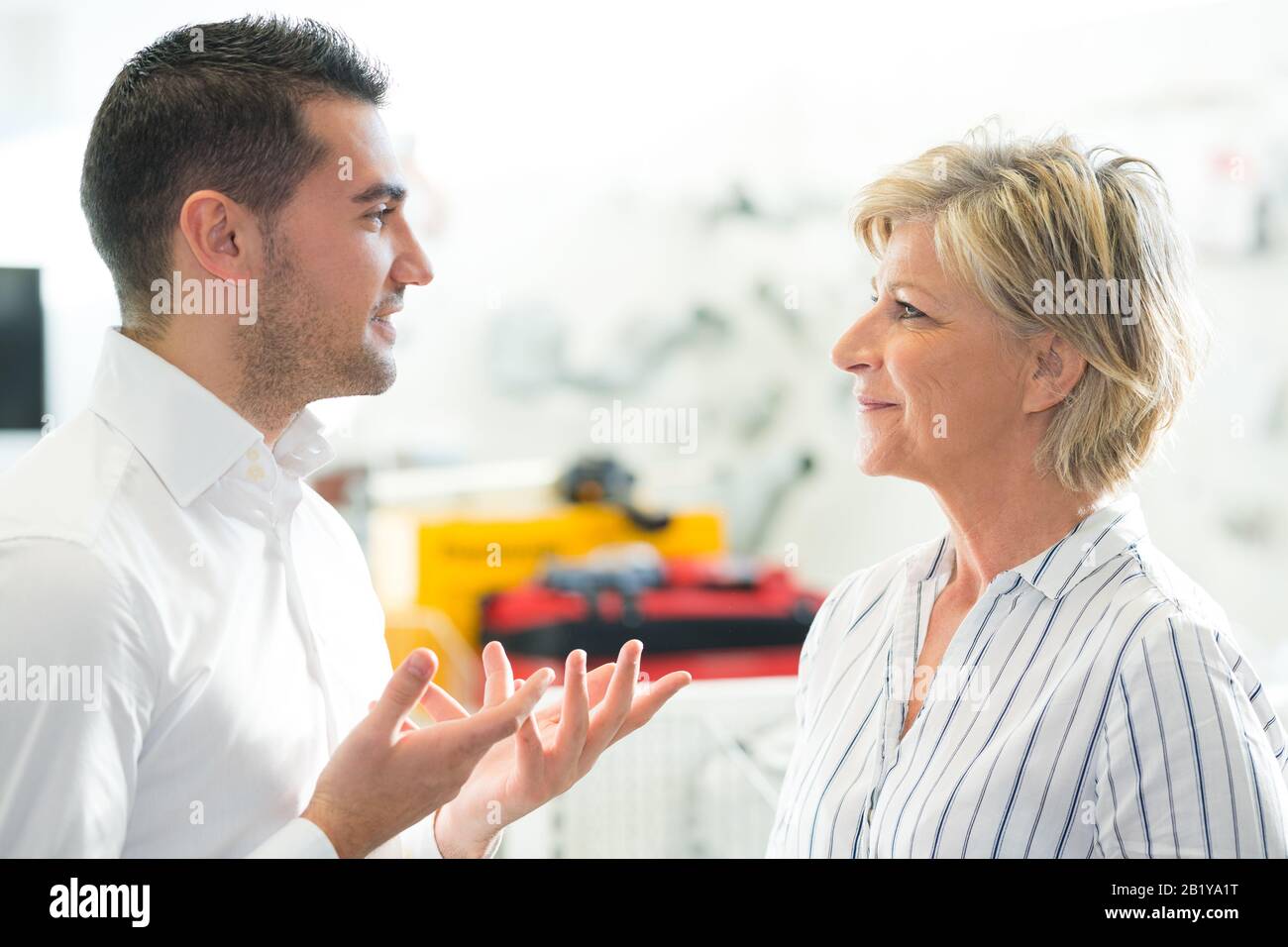 two colleagues having a conversation Stock Photo - Alamy