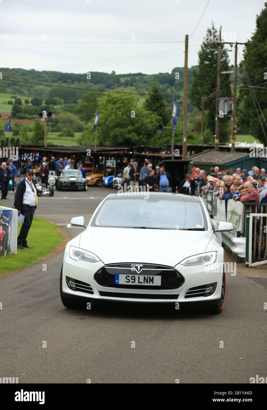 A 2014 Tesla model S being driven at Shelsley Walsh hill climb ...
