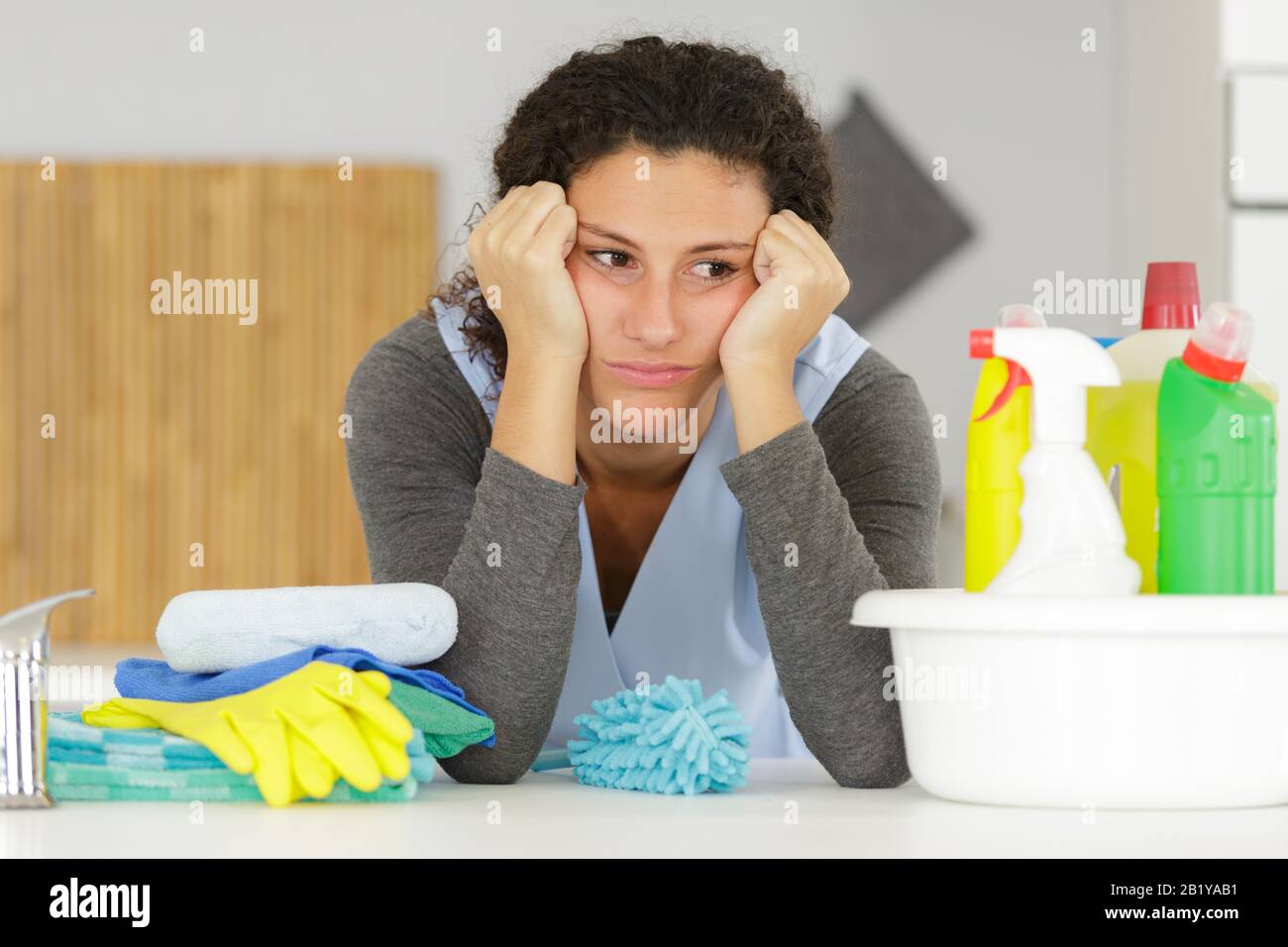 tired woman standing in the kitchen Stock Photo - Alamy