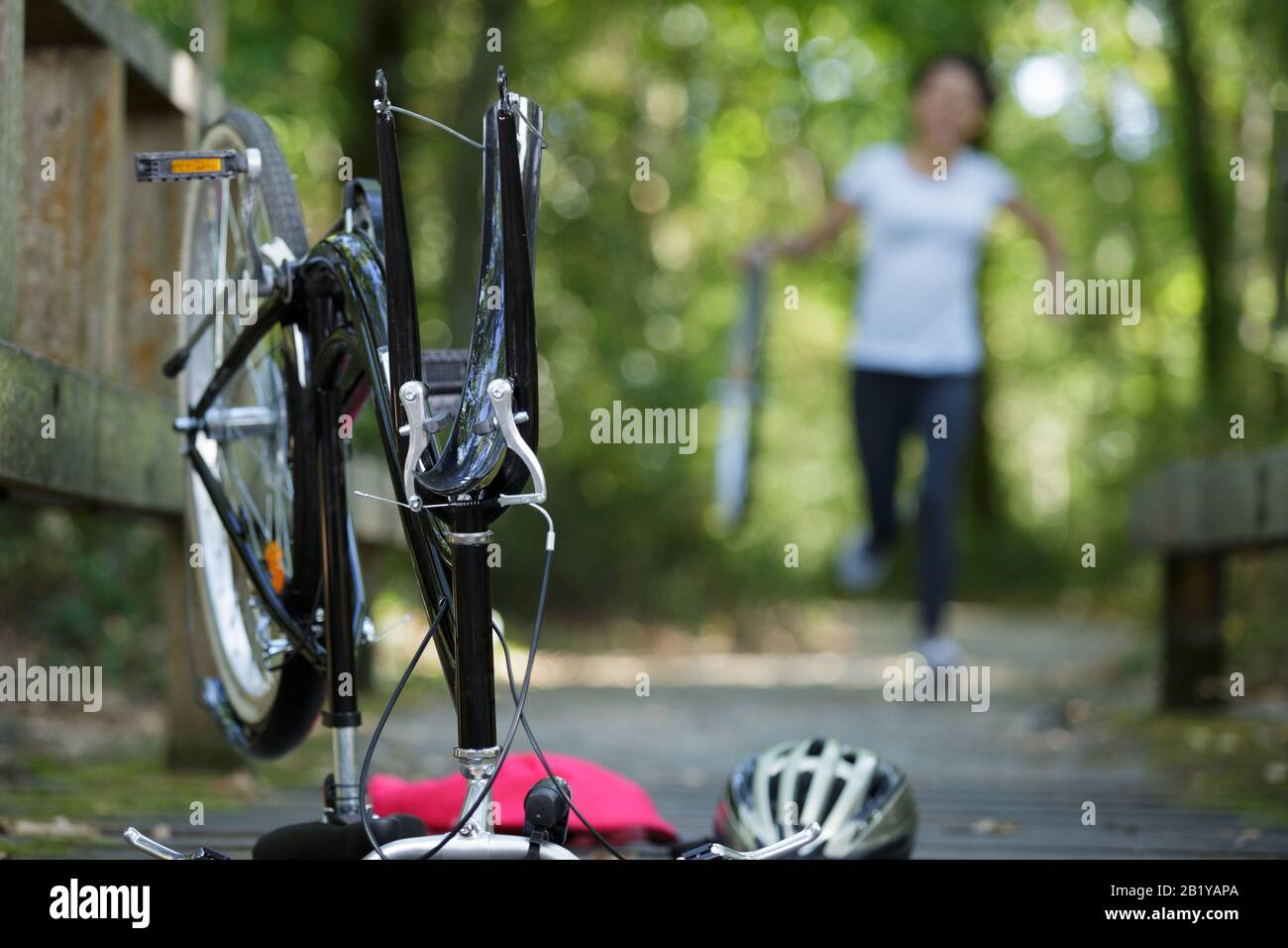 Woman with broken bike hi-res stock photography and images - Alamy