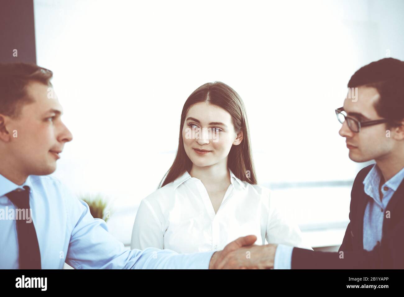 Business people shaking hands at meeting or negotiation. Group of ...