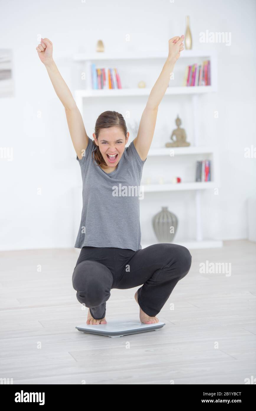 Woman bathroom scale happy hi-res stock photography and images - Alamy