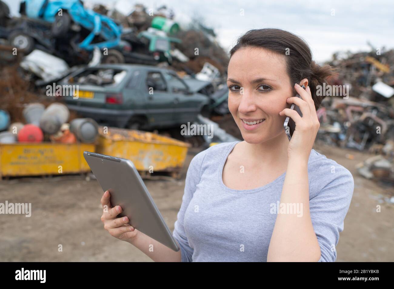 female worker in a scrap recycling yard Stock Photo - Alamy