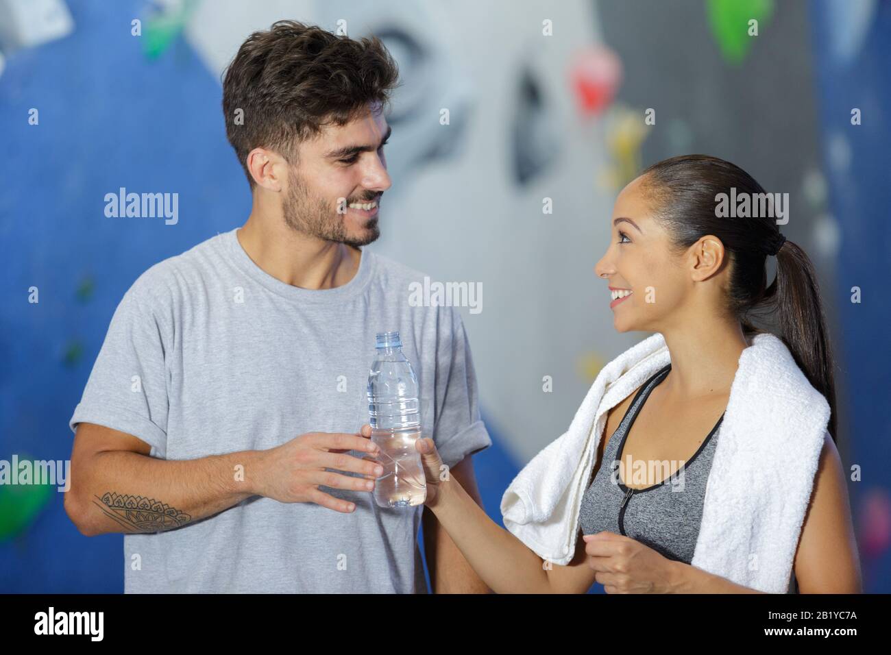 attractive young sports people are talking and smiling Stock Photo - Alamy