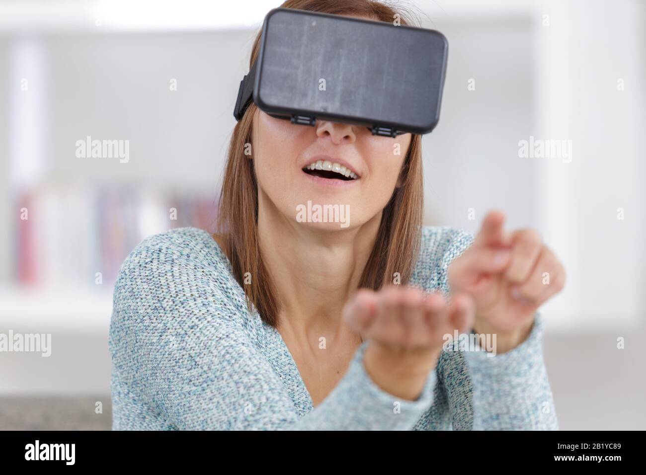 positive delighted female wearing virtual mask Stock Photo - Alamy